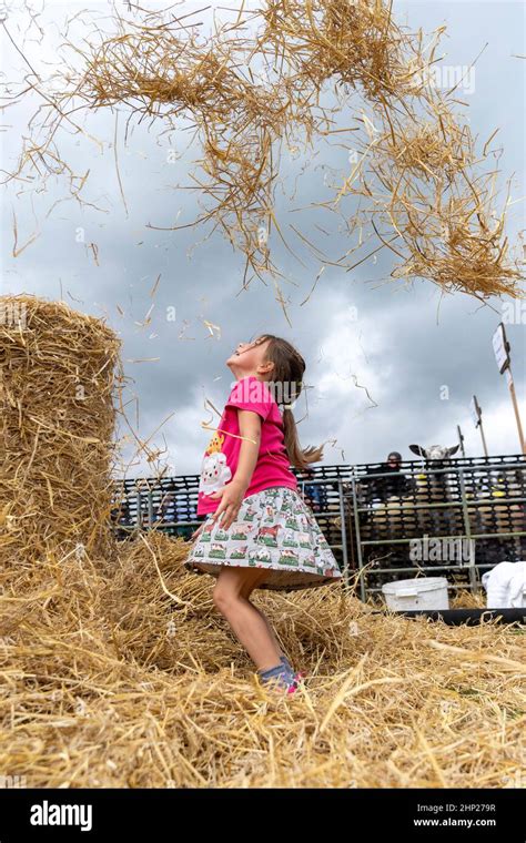 Young Girls Playing In A Bale Of Straw At An Agricultural Show Kelso