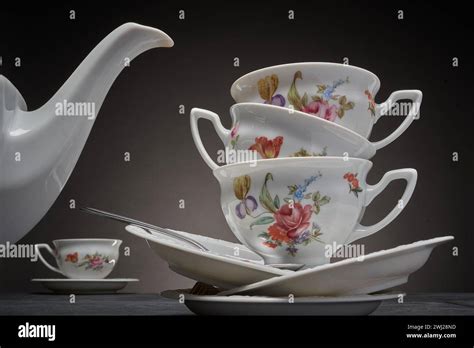 Stacked Coffee Cups And Coffee Pot Stock Photo Alamy