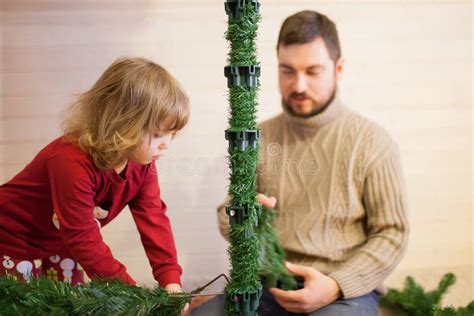 Father And Daughter Assembling Christmas Tree Stock Image Image Of