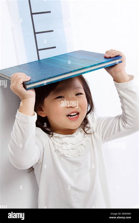 Girl Measuring Height Stock Photo Alamy