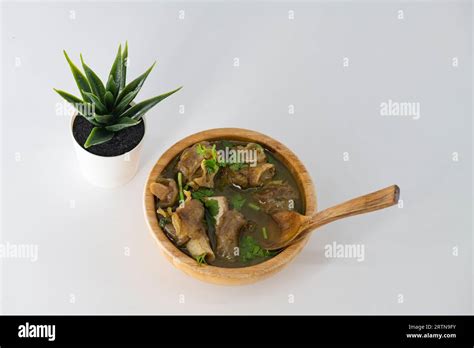 Fresh Spicy Lamb Paya Soup In A Wooden Bowl And Ready To Eat Home Made