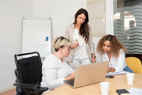 Premium Photo A Businesswoman In A Wheelchair With A Disability Works