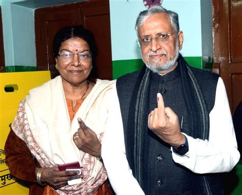 Bjp Leader Sushil Kumar Modi With His Wife Show Ink Marked Finger