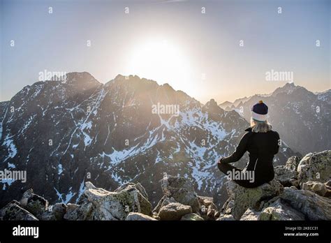 Beautiful Blonde Woman Enjoys Reaching The Summit In The Slovak Tatras And Looks At The Gerlach
