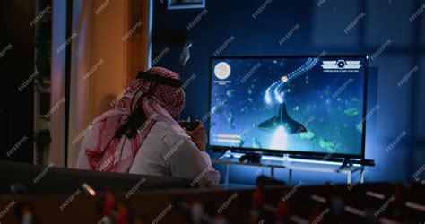 Premium Photo Gamer Using High Tech Gaming System