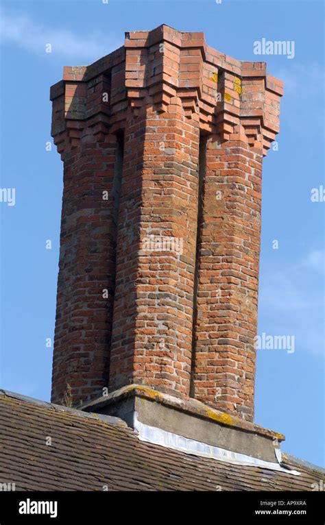Elizabethan Twin Double Chimney Stack On Building In England Uk Stock