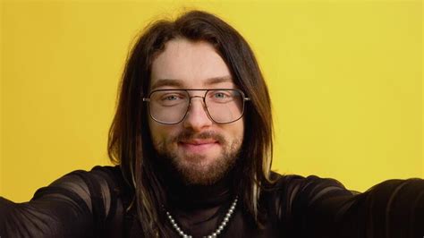 Young Homosexual Or Bisexual Man Makes A Selfie On A Yellow Background
