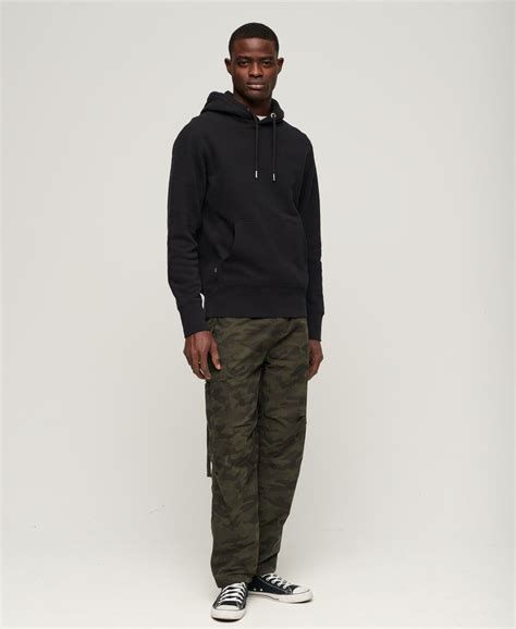 Mens Sportswear Embossed Loose Fit Hoodie In Black Superdry Uk