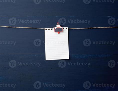 Empty White Notebook Paper Sheet Hanging On Decorative Holiday