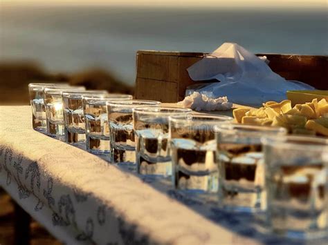 Tequila In Glasses Diagonally At Sunset Vodka Party Stock Image