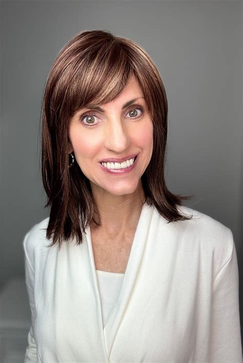 Woman With Shoulder Length Brown Wig With Bangs Tatum By Amore In