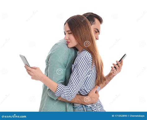 Couple Addicted To Smartphones Hugging On Background Relationship
