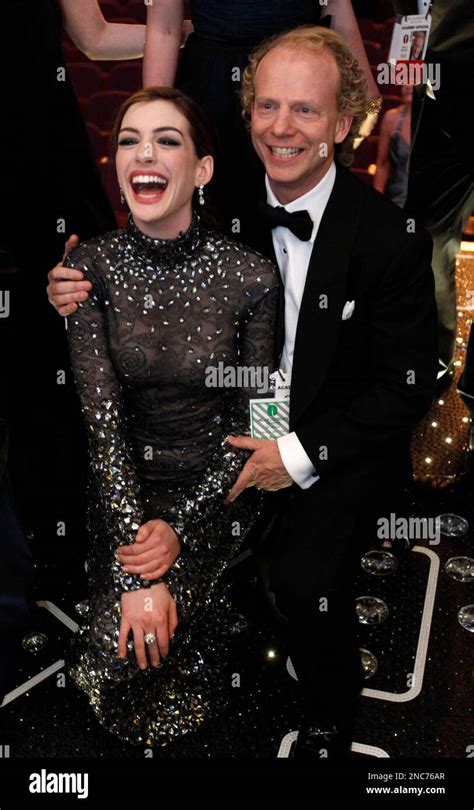 Anne Hathaway Left And Producer Bruce Cohen Pose At The 83rd Academy Awards On Sunday Feb 27