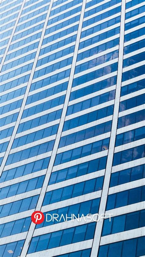 Blue And White Glass Building During Daytime Window Reflection
