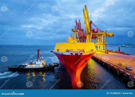 Large Cargo Ship With Containers Loading By Crane At Port Stock