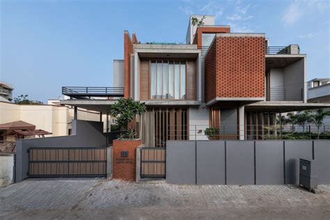 The Residence Features An Exposed Brick Design That Enhances Its Street