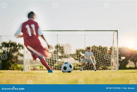 Soccer Goal Post And Ball Soccer Player Running And Kicking To Score