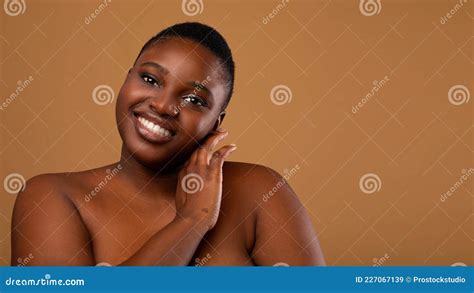 Beautiful Plus Size African American Woman Posing Looking At Camera