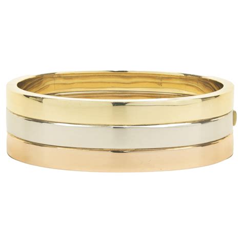 18 Karat Rose Yellow And White Gold Three Row Bangle Bracelet For