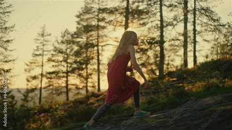 Cinematic Video Of A Cute Teenage Girl Running Fast Going Up A Hill