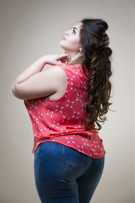 Plus Size Model In Casual Clothes Fat Woman On Beige Background Stock