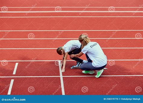 Female Coach Training Athlete Fit Girl Getting Ready To Run On Treadmill At The Stadium Stock