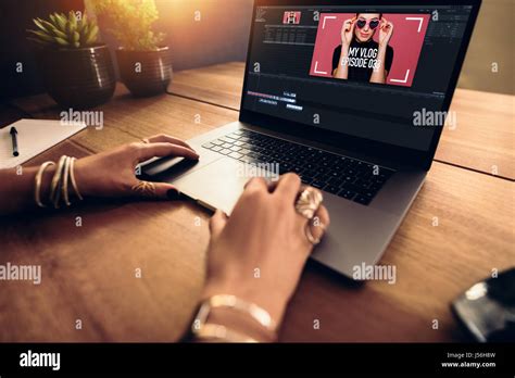 Woman Editing Video On Laptop Computer For Her Vlog Woman Wearing Fashionable Rings Working On