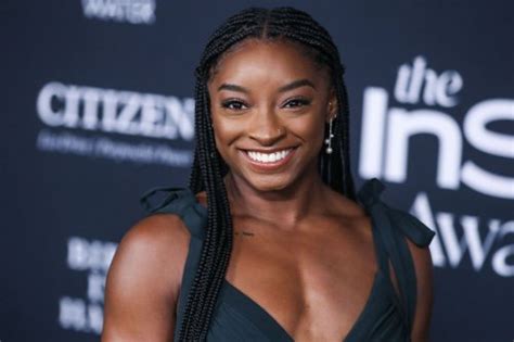 Simone Biles Strikes A Pose In Barely There Heels And Floral Thigh High