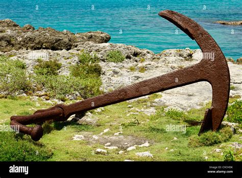 Large Rusty Anchor On Rocky Sea Shore Stock Photo Alamy