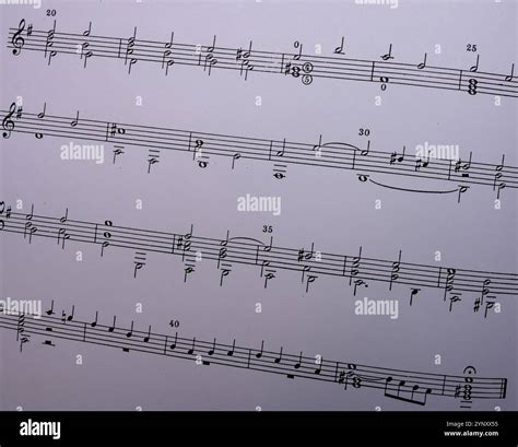 Sheet Music Is Laid Out On A Flat Surface Showcasing Musical Notes And