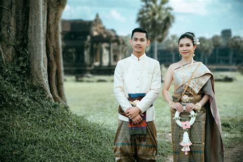 Bride And Groom In Traditional Cambodian Wedding Clothing Standing On A
