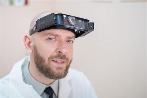 Premium Photo Portrait Of Doctor Wearing Magnifying Glass