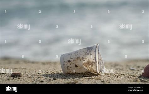 Plastic Debris Pollution Discarded On Sea Coast Ecosystemcigarette