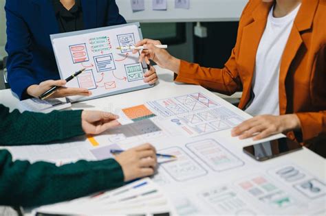 Ux Developer And Ui Designer Brainstorming About Mobile App Interface Wireframe Design Stock