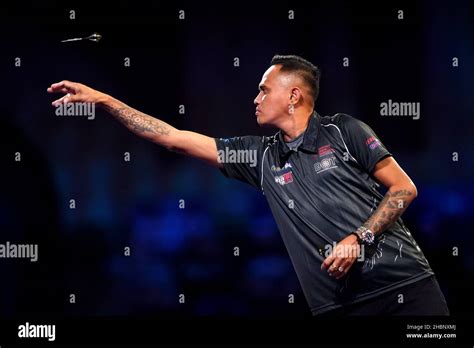 Lourence Ilagan In Action Against Raymond Van Barneveld During Day Six Of The William Hill World