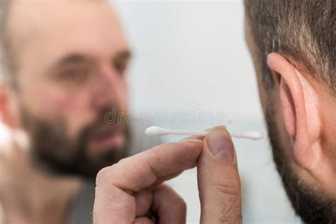 Man Removing Wax From Ear Using Q Tip Stock Image Image Of Clean