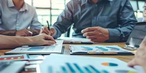 Colleagues Engaging In Data Analysis Discussion At A Meeting Concept