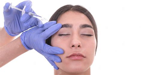 Premium Photo Young Woman Gets Injection Of Botox In Her Lips Woman In Beauty Salon Plastic