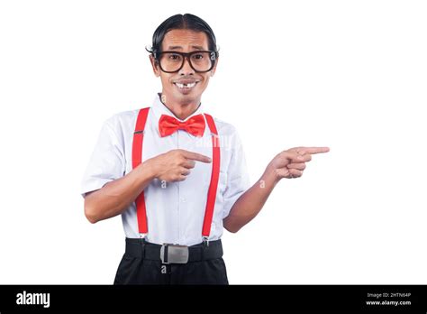 Asian Nerd With An Ugly Face Pointing Something Isolated Over White Background Stock Photo Alamy