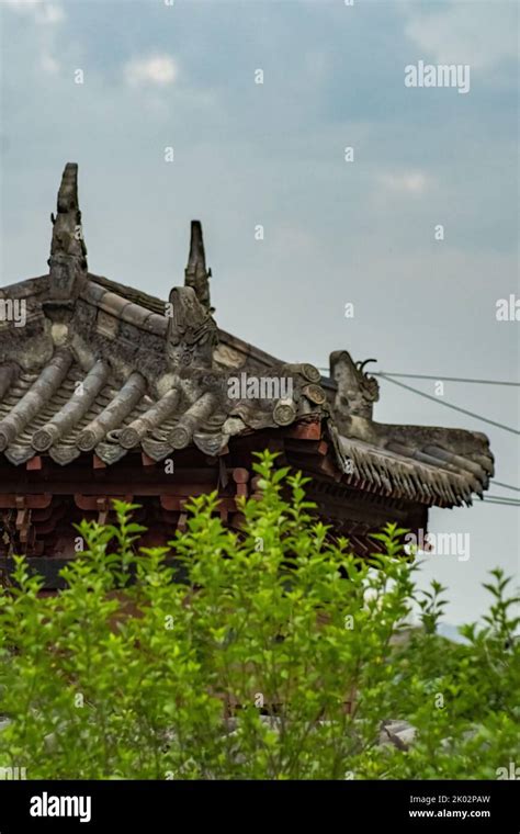 A Vertical Shot Of A Roof Of An Old Asian Style Pavilion In Qinglonghu