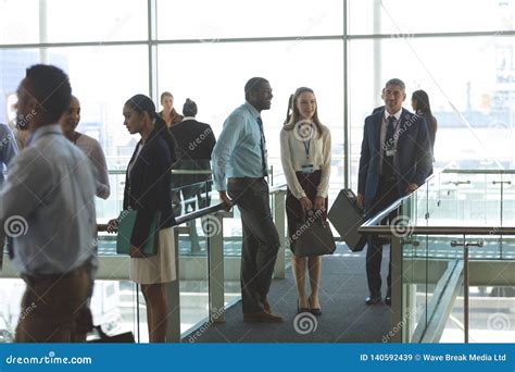 Business Executives Interacting with Each Other in Office Stock Image - Image of businesswoman ...