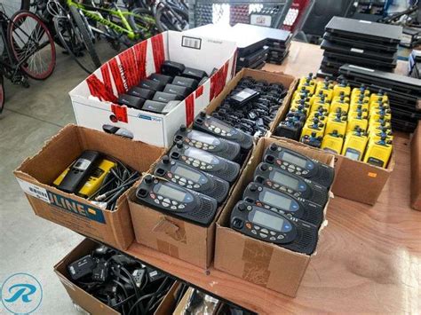 Trays Of TAIT Way Radios Batteries Chargers And Radios Roller Auctions