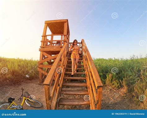 Woman At Viewpoint Girl Descending Stairs Of Viewpoints And A Young