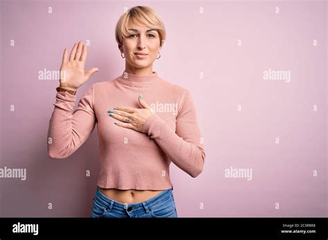 Young Blonde Woman With Short Hair Wearing Casual Turtleneck Sweater