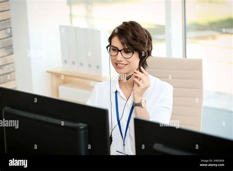 Female Technical Support Operator With Headset At Workplace Stock Photo Alamy