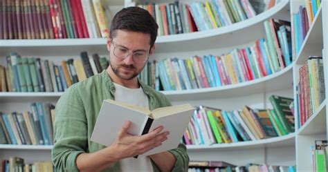 Premium Photo Portrait Of Focused Man In Glasses Reading Book From