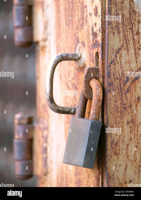Rusty Old Padlock On An Iron Door Stock Photo Alamy