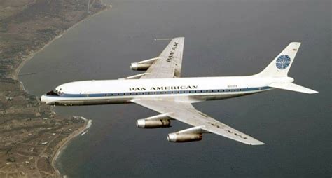Pan Am Dc 8 Vintage Aircraft Flying Over Water And Land