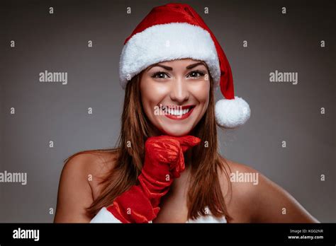 Portrait Of A Beautiful Young Smiling Woman In Santa Claus Costume