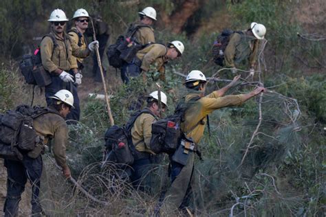 In Photos Fast Moving California Wildfire Burns Homes And Triggers